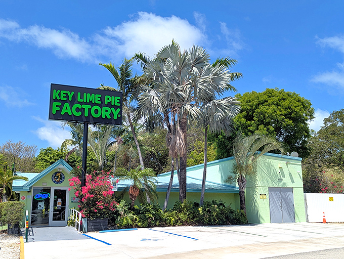 The mint-green facade of the Key Lime Pie Factory stands out against the Florida sky, promising sweet citrusy treasures within.