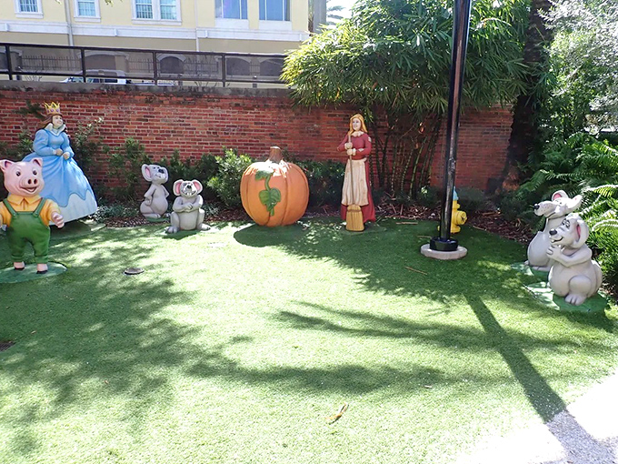 Fairytale figures stand guard at Ulele, where storybook characters mingle with diners in a whimsical Tampa setting.