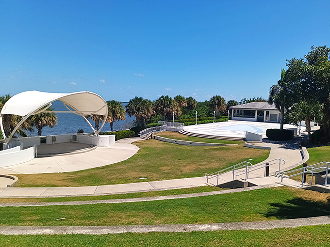 A waterfront amphitheater with elegant curved canopy sits perfectly positioned to capture both performances and breathtaking Indian River views.