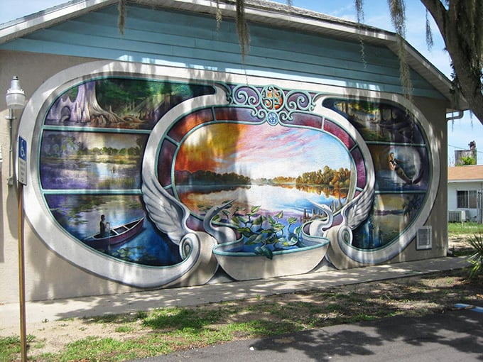 Serene waters reflect in this dreamlike mural, where swans and landscapes merge in a symphony of color that captures Lake Placid's natural beauty.
