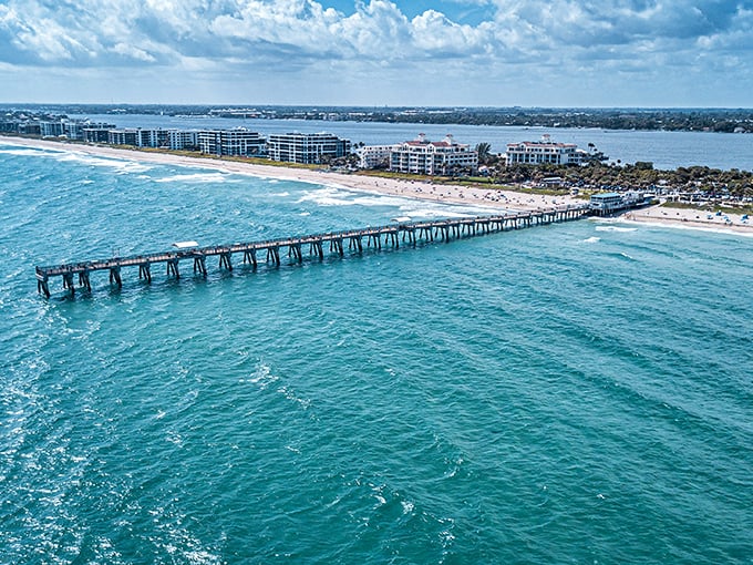 Lake Worth Pier stretches like a wooden runway into the Atlantic, promising adventures for fishermen and beach lovers alike.