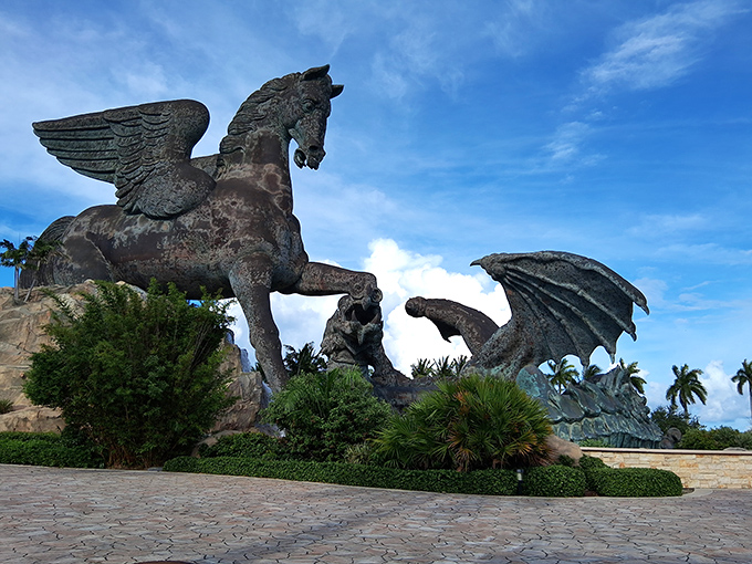 Mythological titans clash under Florida's azure sky – Pegasus triumphantly rears above a writhing dragon in this colossal 110-foot bronze masterpiece.