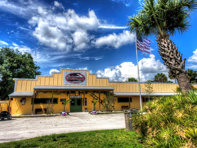 That cheerful yellow exterior hides hundreds of prehistoric predators lounging just beyond those walls, living their best reptilian lives.