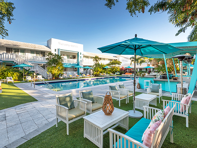 A splash of Miami Modern magic where turquoise umbrellas and white architecture create the perfect Florida fantasy poolside retreat.