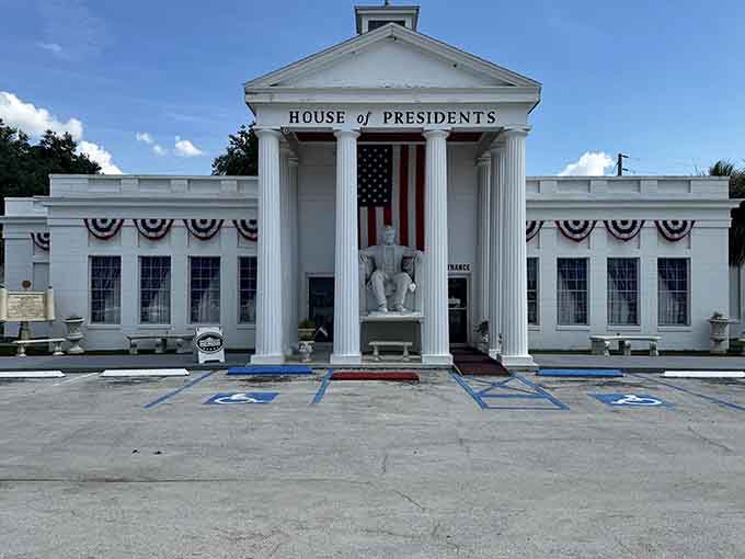 The Presidents Hall of Fame exterior looks like someone hit the White House with a shrink ray and dropped it in Central Florida, complete with patriotic bunting.