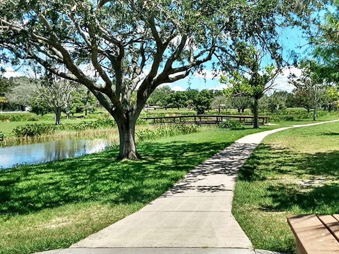 Where winding paths meet waterfront views, and your biggest decision is which bench to claim for your afternoon nap.