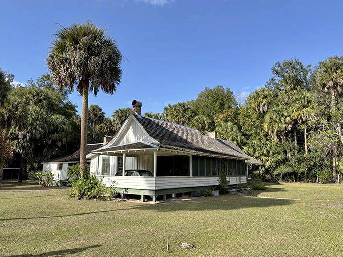 The Cracker-style farmhouse stands timelessly amid towering palms, looking exactly as it did when a Pulitzer Prize was born here.