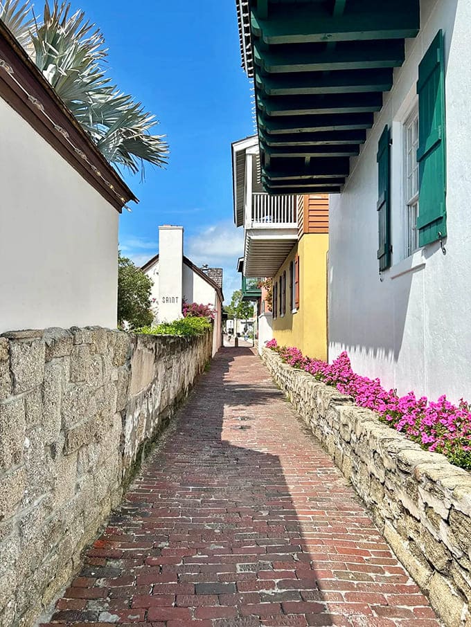 Treasury Street's narrow brick passage feels like a secret corridor between centuries, where modern visitors walk the same path Spanish soldiers once patrolled.
