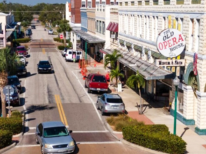 Arcadia's main street whispers tales of yesteryear, where historic buildings stand proud like sentinels guarding treasures within. The Old Opera House sign beckons curious souls.