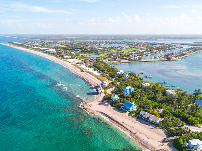 Treasure Island's stunning coastline stretches into the distance, where emerald waters meet powder-white sand in a postcard-perfect Florida panorama.
