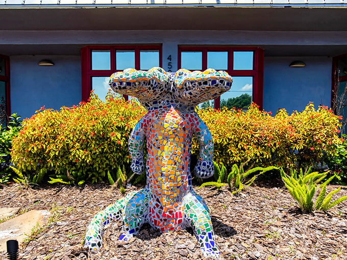 The iconic mosaic two-headed gator welcomes visitors to Seminole Heights with a kaleidoscope of colors and twice the toothy grin.