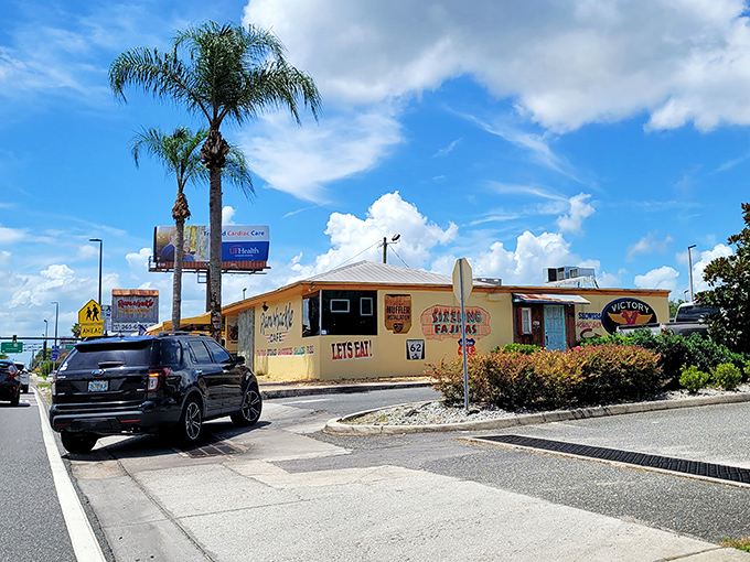 The unassuming exterior of Ramshackle Cafe beckons hungry travelers with its cheerful yellow walls and promise of being "Locally World Famous" – truth in advertising at its finest!