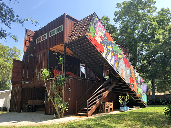 Industrial meets artistic brilliance in this shipping container masterpiece, where rust-colored steel and vibrant murals create Florida's most photographable facade.