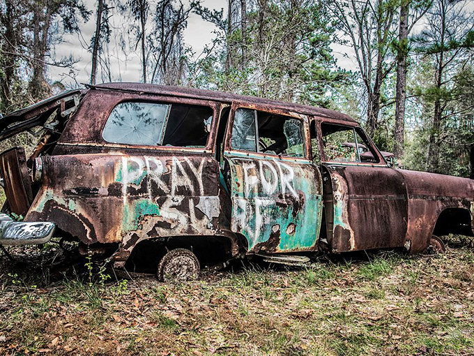 PRAY FOR &ndash; mysterious graffiti adds another layer to this abandoned wagon's untold story of highways and byways past.