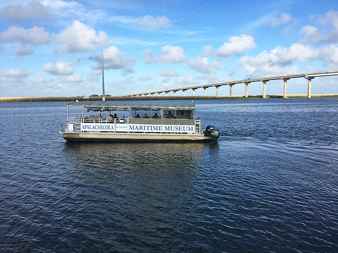 The museum's tour boat glides across Apalachicola Bay, offering passengers spectacular views and insights into the region's maritime ecosystem.