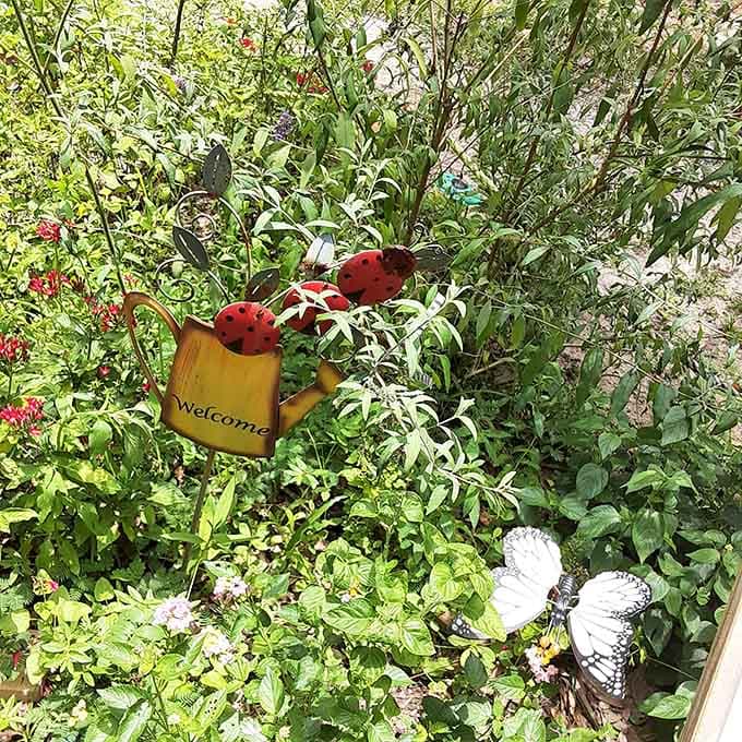 Whimsical metal garden art adds personality to the landscape, making every corner worth exploring and photographing.