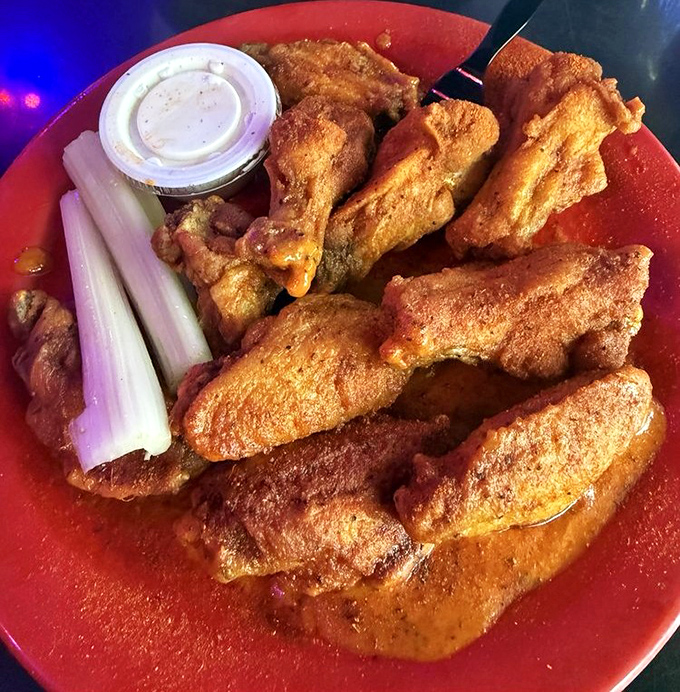 These golden-battered beauties pack a Mardi Gras of flavor in every bite. The celery sticks stand by like loyal friends ready to cool your palate.