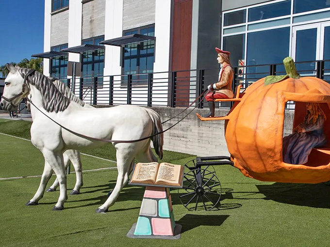 This elegant pumpkin carriage awaits its princess, white horses standing eternally ready for the ball to begin.