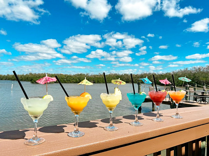 A rainbow of tropical concoctions lined up like liquid sunshine &ndash; each tiny umbrella promising a mini-vacation with every sip.