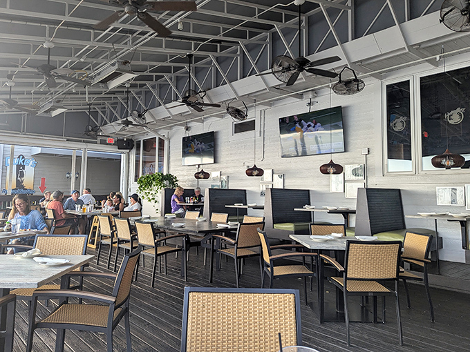 Airy, open dining spaces with ceiling fans spinning lazily overhead, creating the perfect backdrop for long lunches that turn into early dinners.