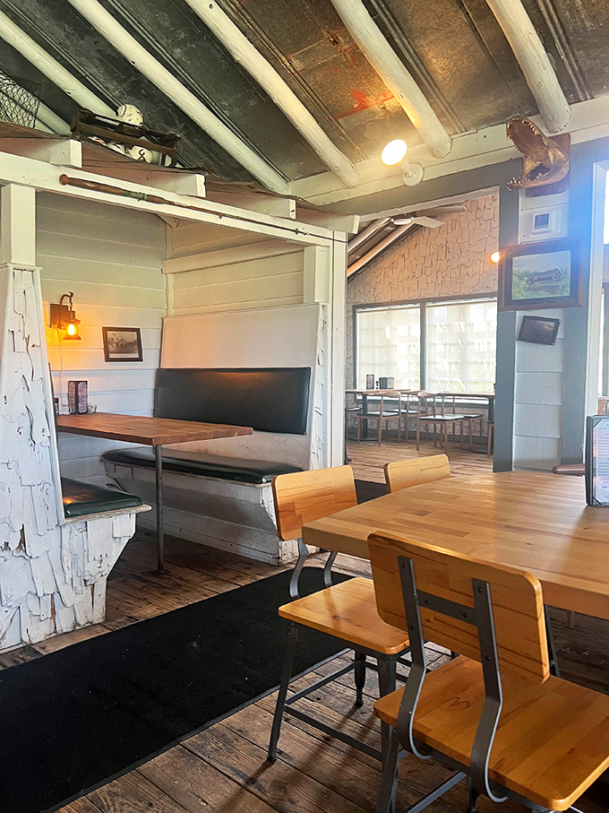 Every architectural detail tells a story, from exposed beams to whitewashed brick, creating a space that feels both timeless and perfectly of its place.