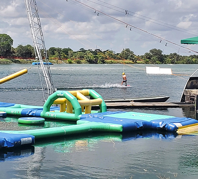 This floating obstacle course proves that falling into water never stops being funny, regardless of your age or athletic ability.