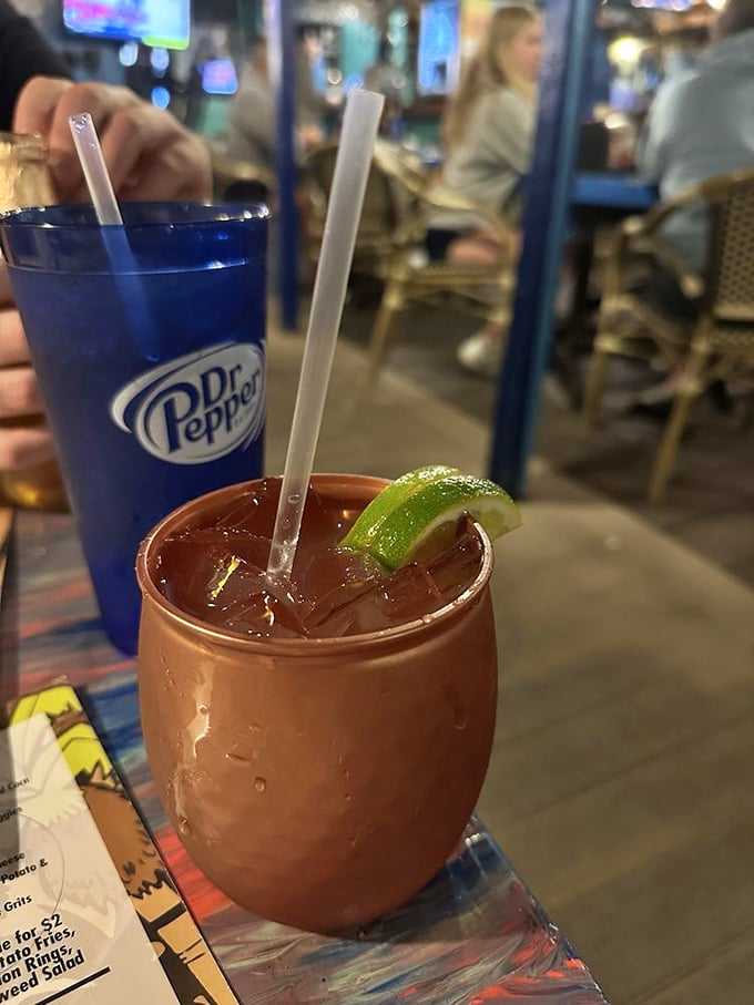 This copper mug cradles a Mayan Mule with zesty lime and ginger, the perfect companion for watching boats drift by on a lazy afternoon.