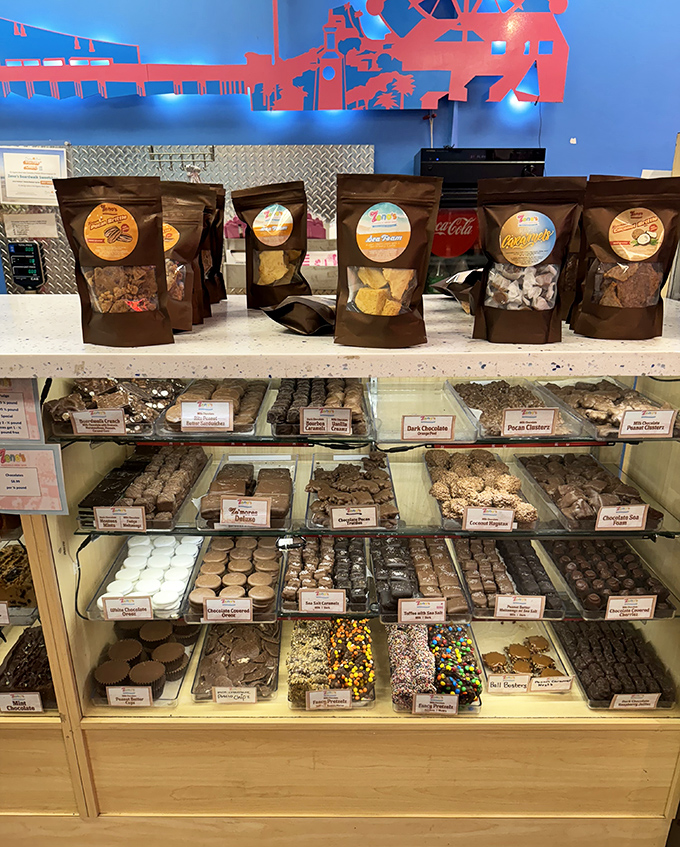 The chocolate and fudge display case showcases edible artistry – slabs of sweetness arranged with the care usually reserved for museum exhibits.