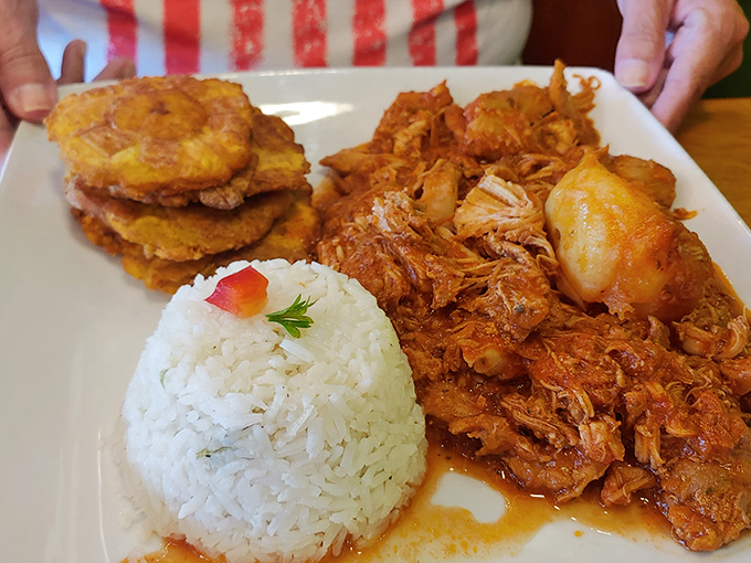 Pollo En Fricas&eacute; &ndash; tender chicken swimming in a tomato bath with potatoes and vegetables, comfort food with a Cuban passport.