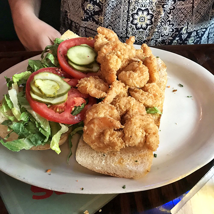 A shrimp po'boy that requires strategic eating and zero regrets. Fresh, crispy, and generous &ndash; the sandwich trifecta achieved.