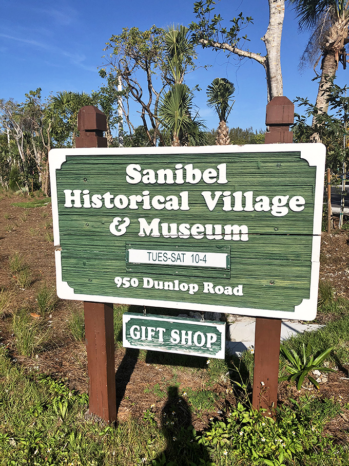 The village's distinctive green sign welcomes history hunters and curious wanderers alike, promising treasures beyond the gift shop.