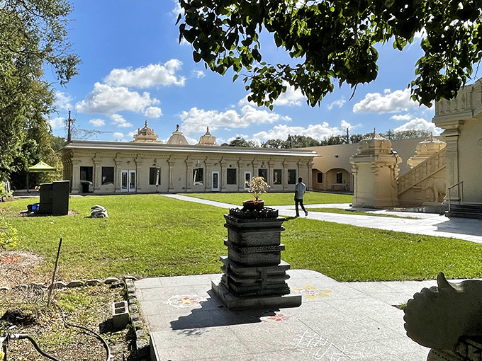 Peaceful grounds surround the temple, offering quiet spaces where visitors can reflect or just catch their breath after climbing those stairs.