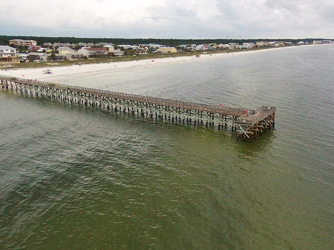 The wooden pier cuts through turquoise waters like an exclamation point, announcing "Paradise found!" to anyone lucky enough to visit.