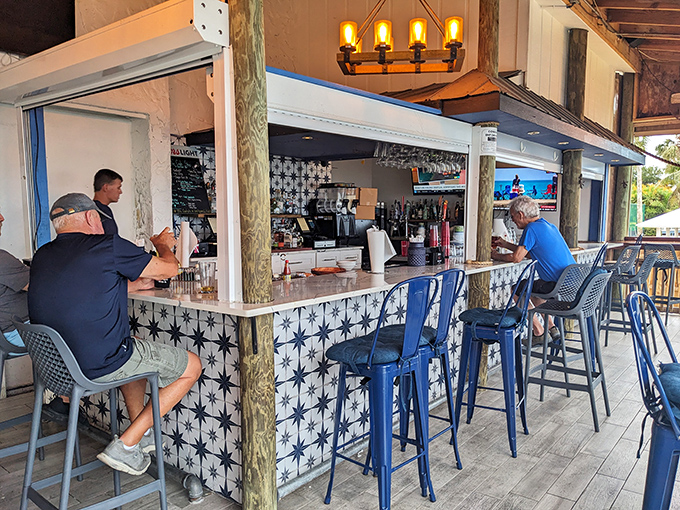 Blue stools invite patrons to belly up to this coastal-themed bar, where conversations flow as freely as the drinks.