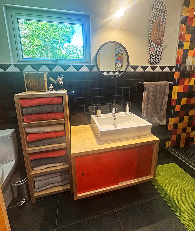 Geometric tiles and clever storage solutions prove that even the smallest spaces deserve big personality in this container conversion.