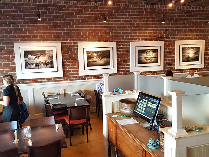 Brick walls and framed photography create the perfect backdrop for memorable meals and even more memorable conversations.