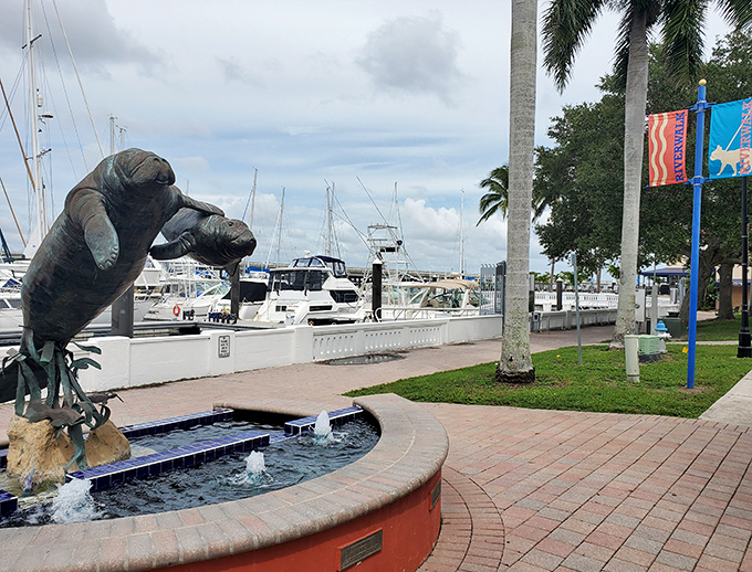 Manatee sculptures splash in their fountain, living their best bronze lives while reminding us of their real-life cousins nearby.