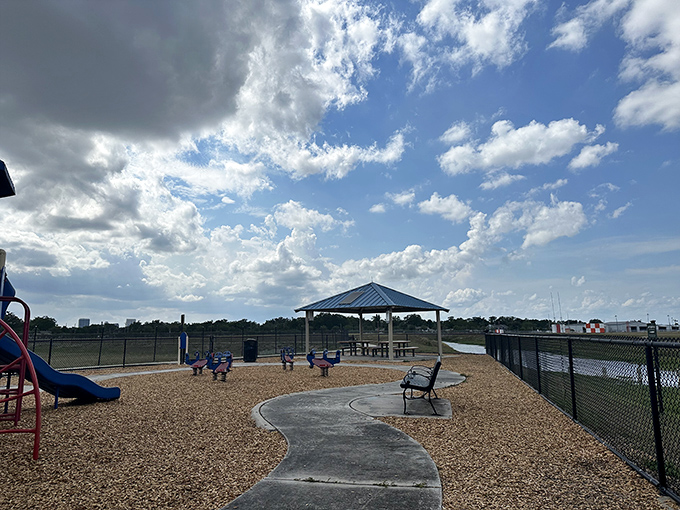 The park's pavilion offers shade and shelter, a gathering place where strangers become neighbors and family stories unfold.