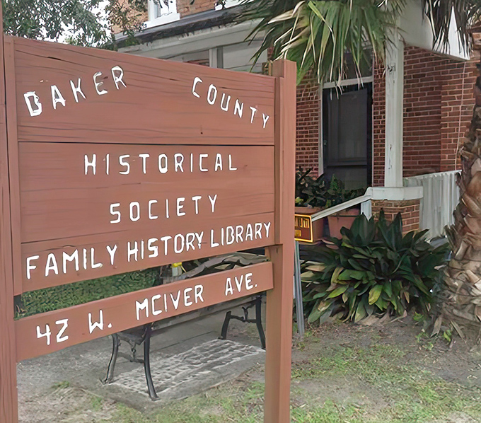 The Historical Society sign stands as guardian to family stories that intertwine like the roots of Baker County's ancient oak trees.