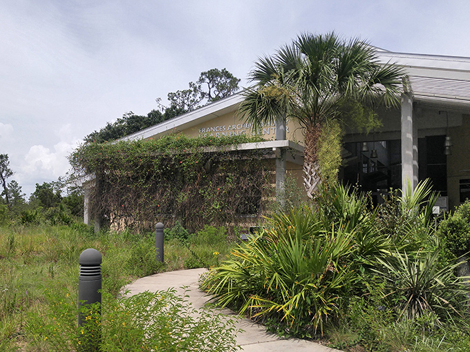 Native plants frame the path to the Learning Center, where scientific knowledge is served up with a side of wonder and excitement.