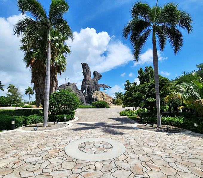 Dawn's gentle light reveals the statue's weathered patina, telling tales of Florida storms weathered with mythological stoicism.