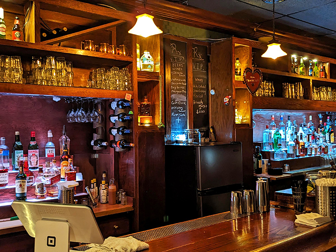 The bar area channels vintage speakeasy vibes with warm wood tones and enough bottles to survive another Prohibition.