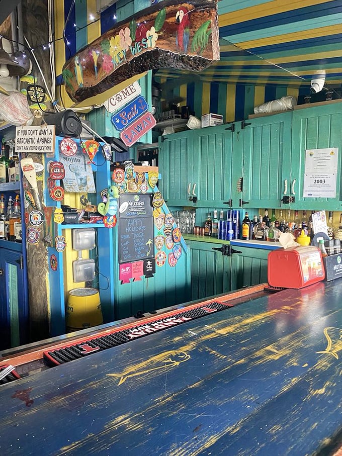 The bar area pops with Caribbean colors and character, where every sticker and sign tells a story of good times and island vibes.