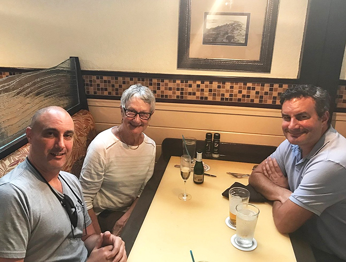 Happy faces gathered around a table, creating memories that will last longer than the meal itself.