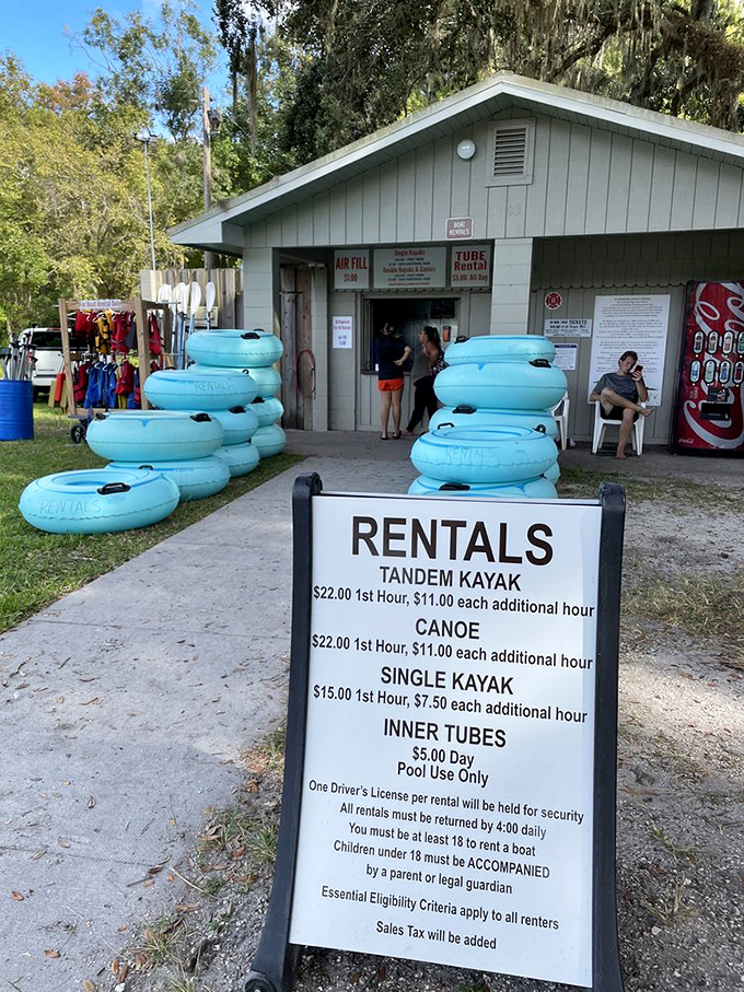 Blue inner tubes stack like delicious donuts, promising cool relief from Florida's heat. The hardest decision: kayak, canoe, or just float the day away?