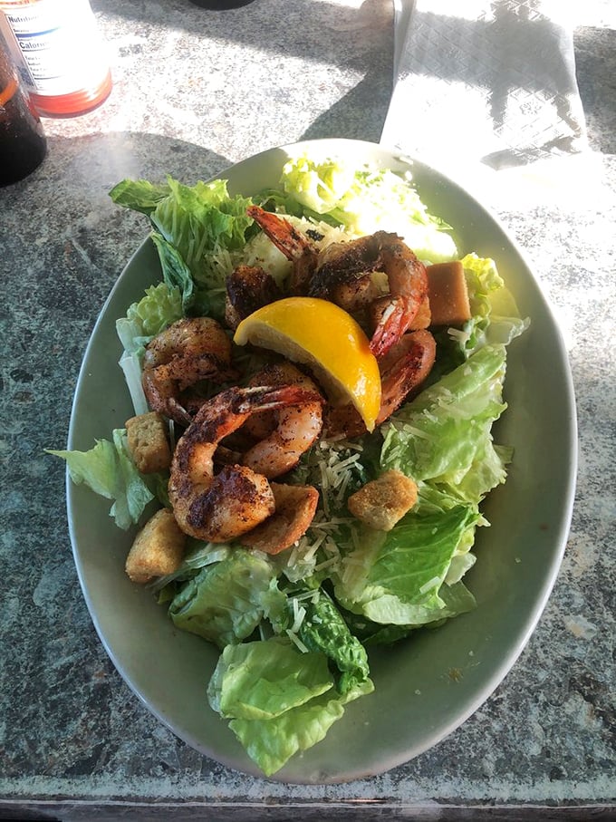 A Caesar salad elevated by perfectly seasoned shrimp &ndash; where greens become a worthy stage for Gulf treasures.