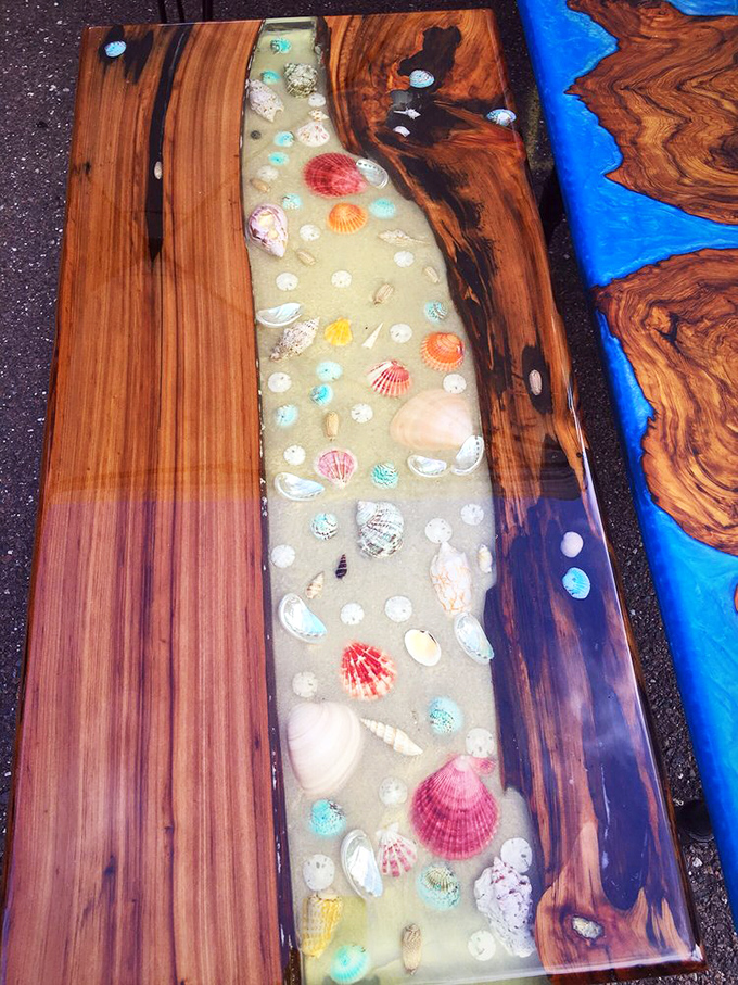 This stunning handcrafted table transforms resin, wood, and seashells into functional art – bringing the ocean's beauty indoors for lucky buyers.