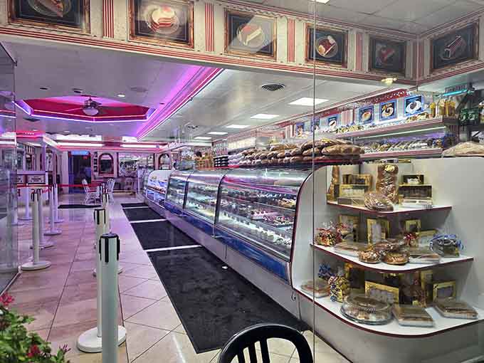 The bakery case stretches on like a delicious dream, filled with pastries that make choosing just one nearly impossible.