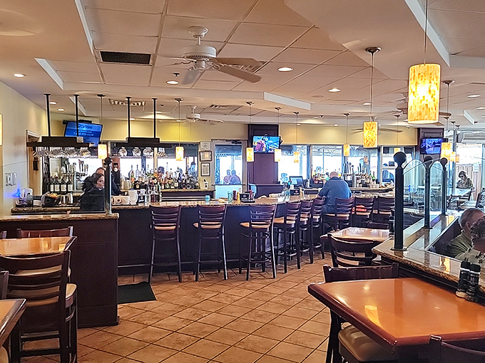 The inviting indoor bar area balances casual comfort with that unmistakable Florida beach vibe.