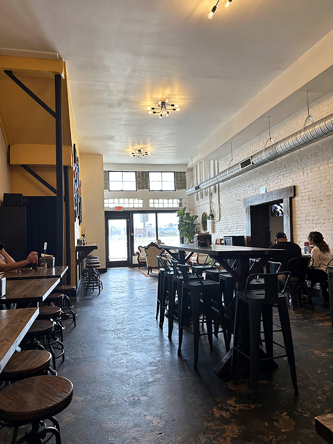 Industrial-chic meets cozy comfort in this thoughtfully designed space where exposed ductwork and brick walls create Tampa's sweetest gathering spot.
